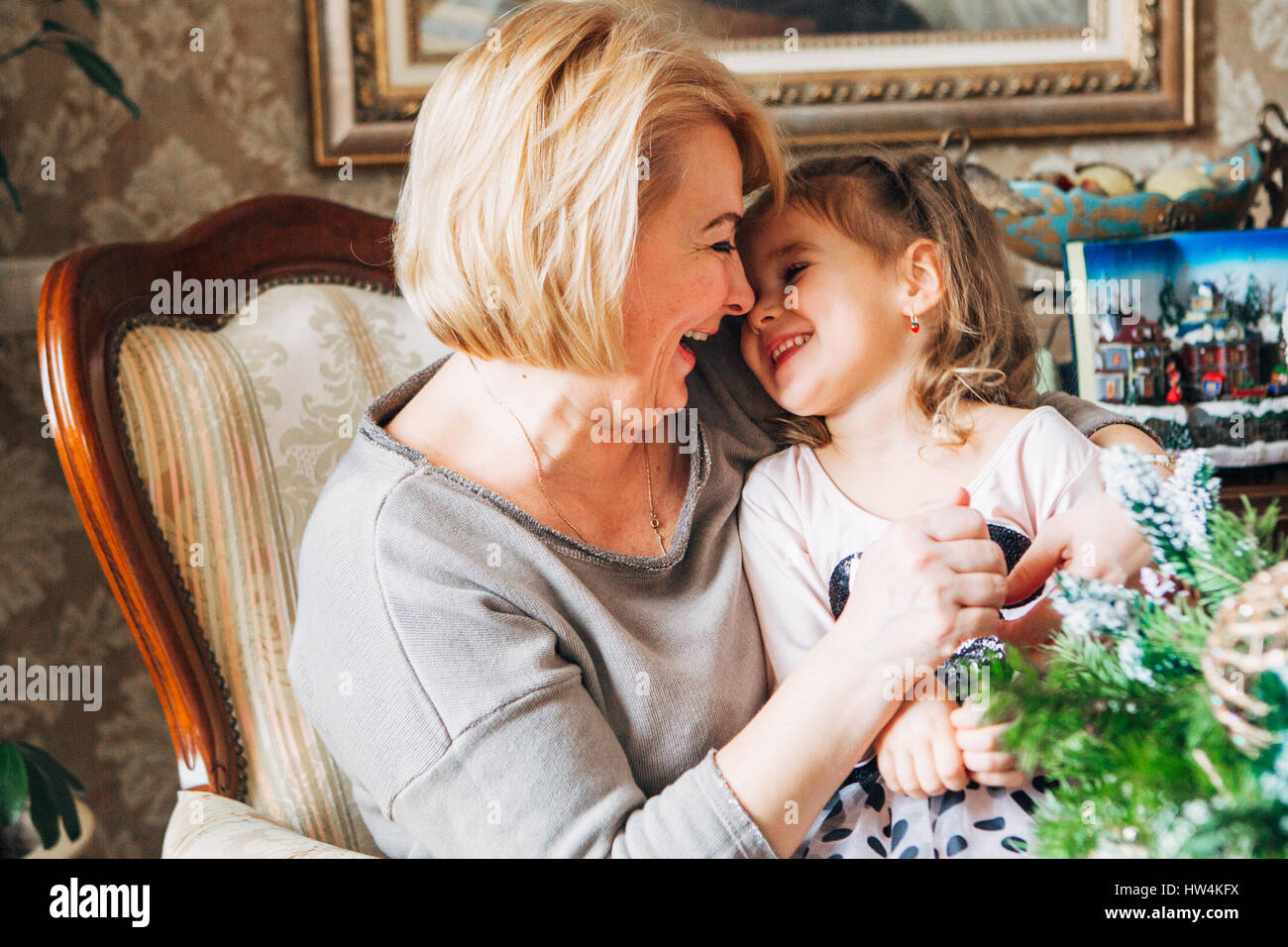 Grandmother with child preparing for Christmas Stock Photo - Alamy
