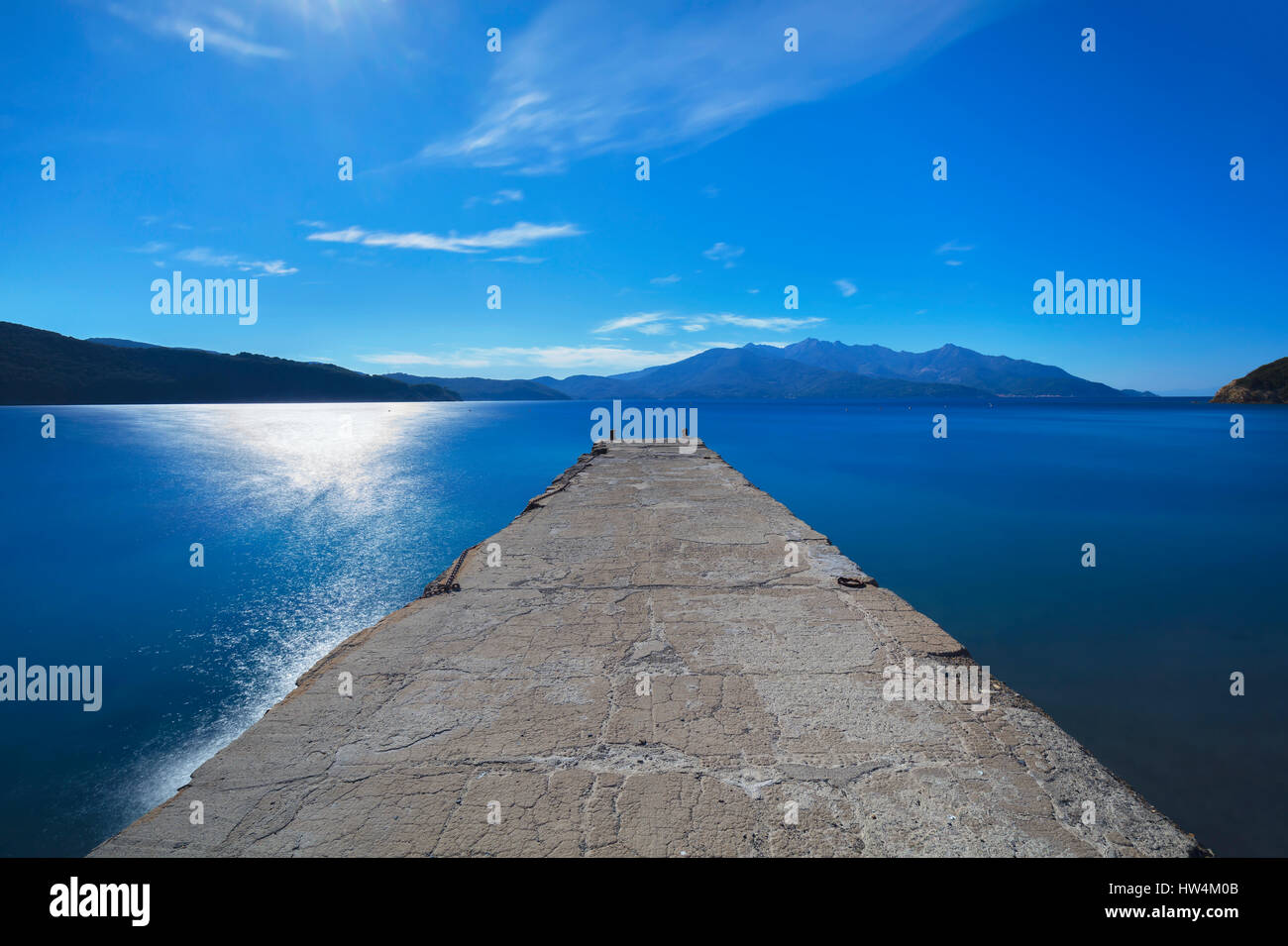 Elba island sea, Portoferraio Enfola pier or jetty and Capanne mountain ...