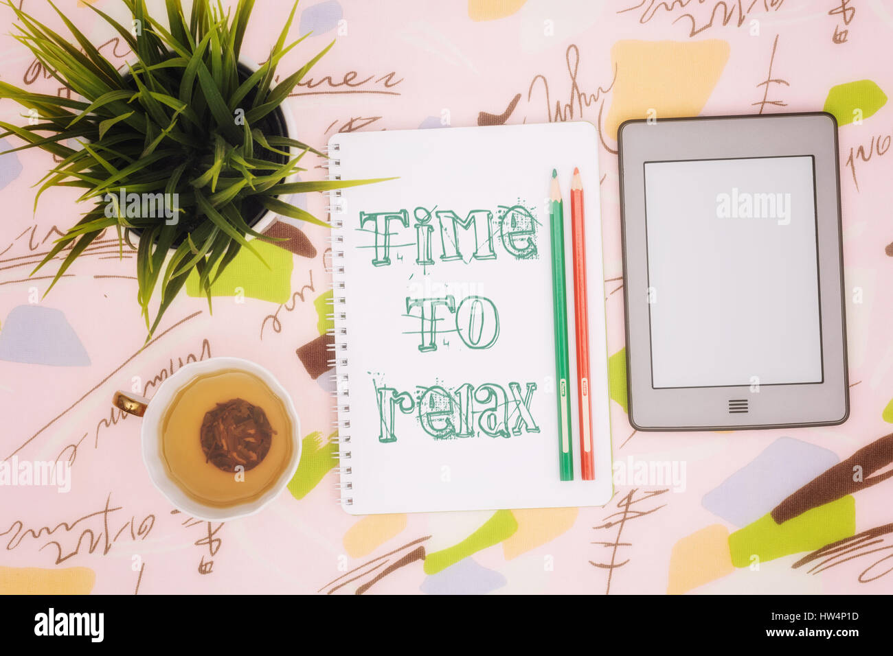 Tea cup, notebook and ebook Stock Photo - Alamy
