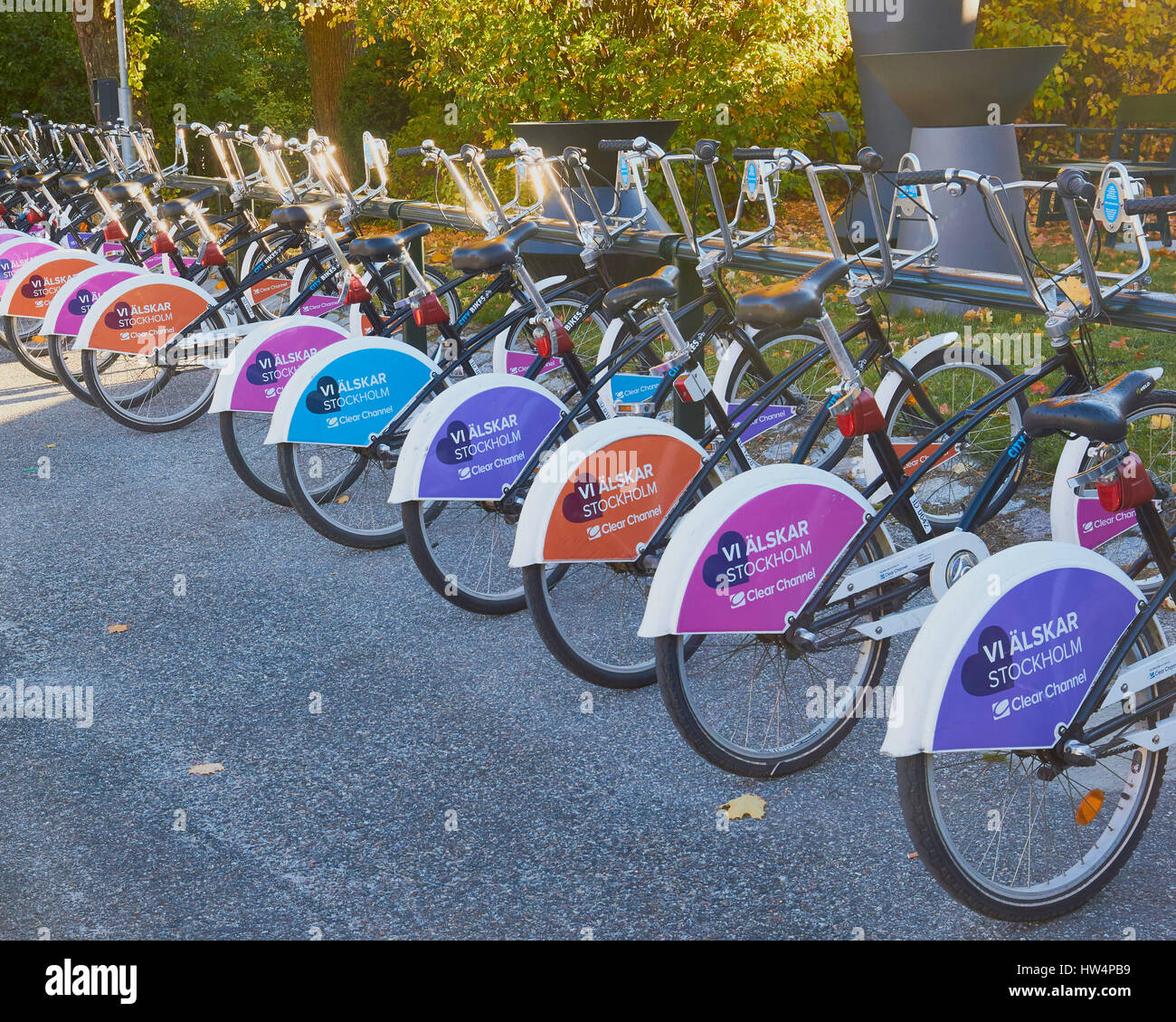 Row of rental bikes in docking station, Skeppsholmen island, Stockholm ...