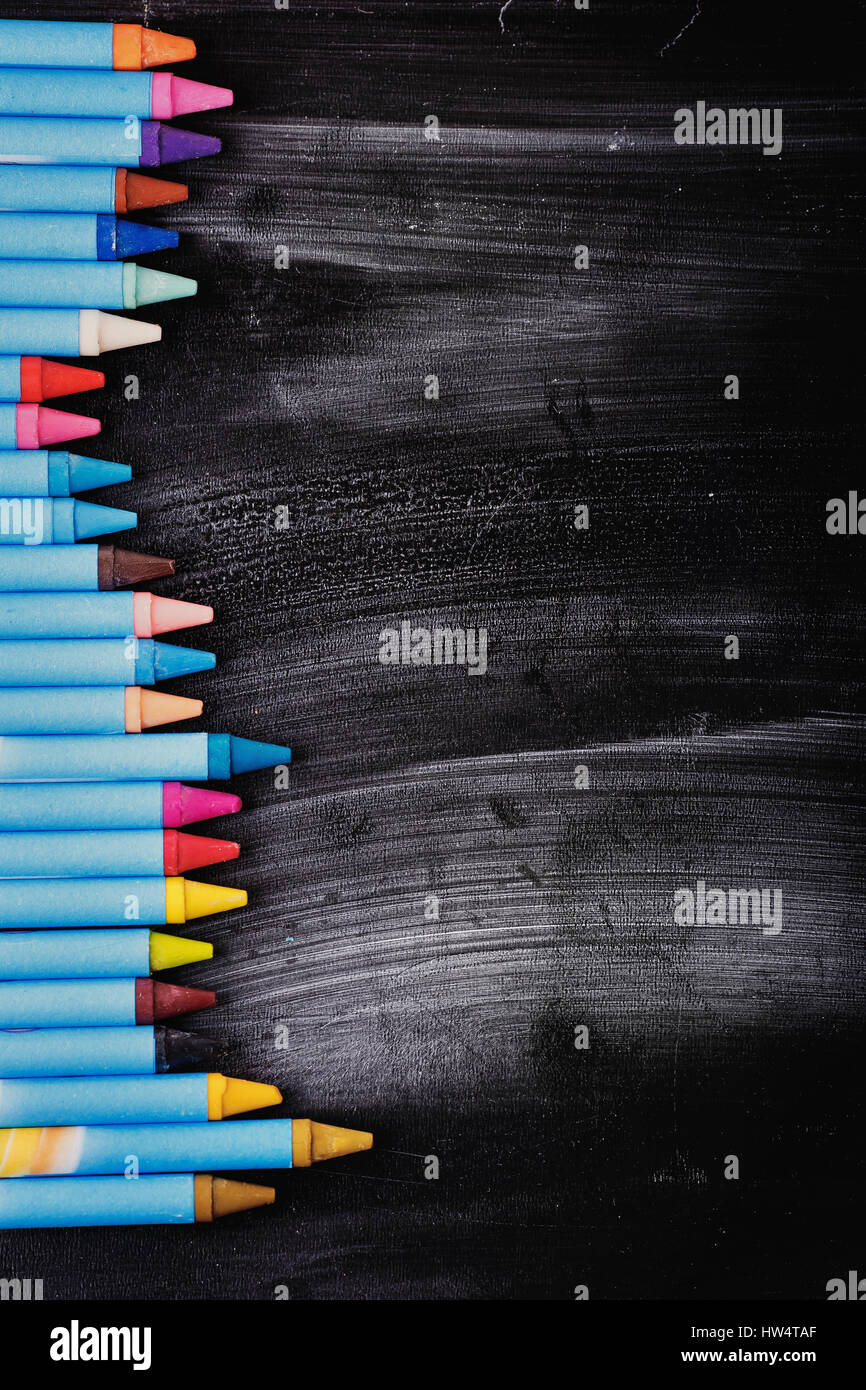 colorful crayons on the board for drawing Stock Photo - Alamy