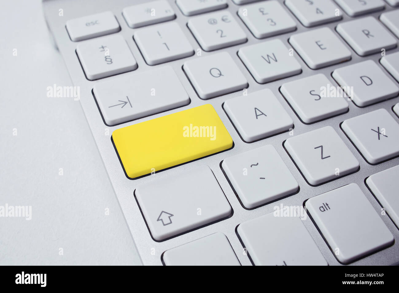dynamic keyboard with yellow button Stock Photo - Alamy