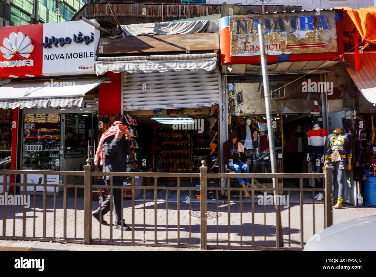 Jordanian man walking at the Bustling downtown of Amman, Jordan Stock ...