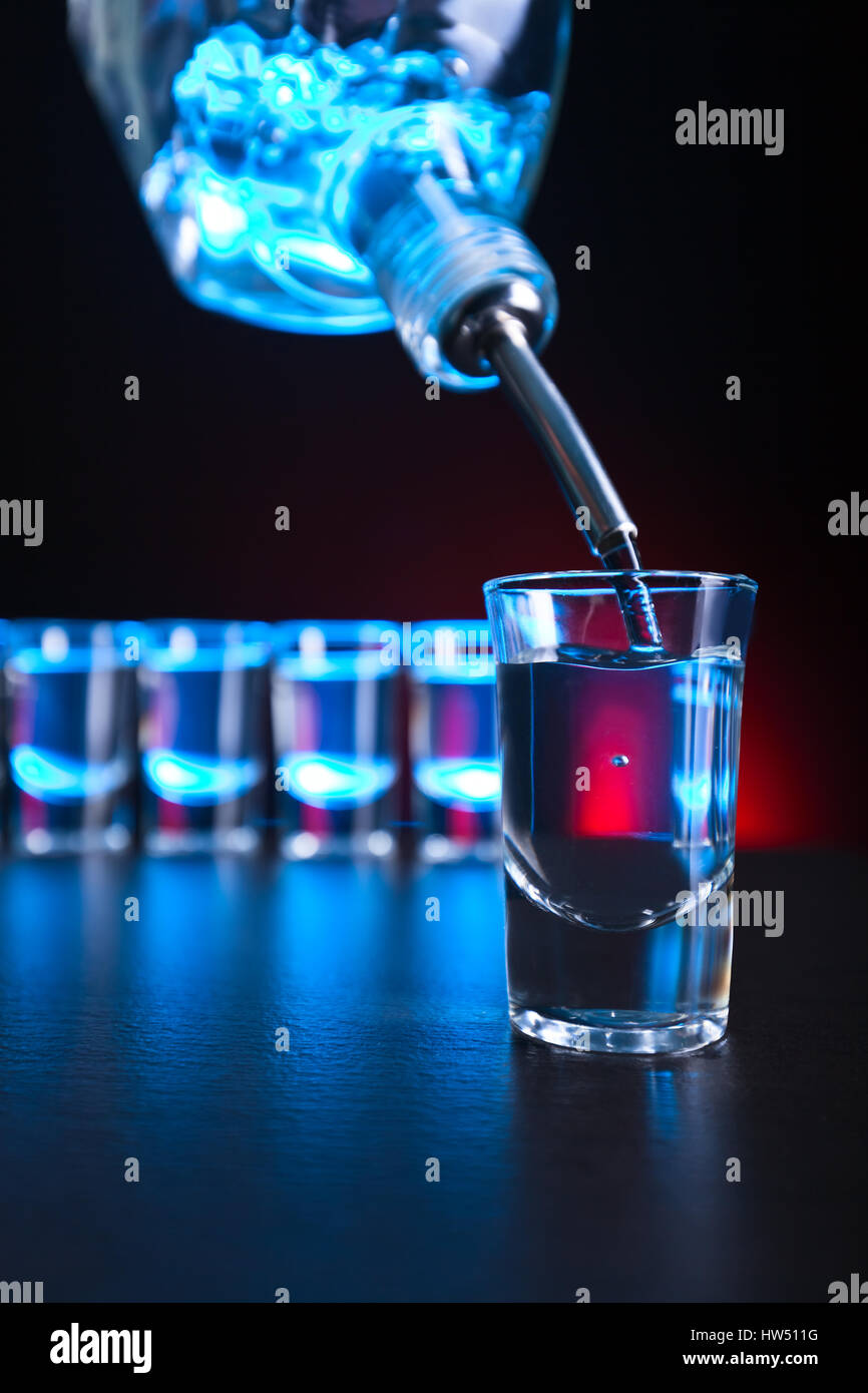 vodka in bar on a black table Stock Photo - Alamy