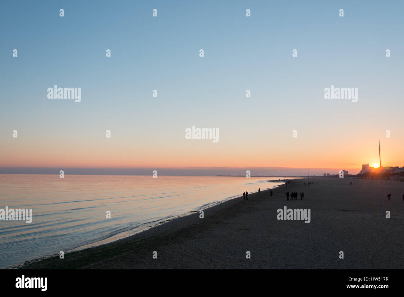 Sunset on the beach Stock Photo - Alamy