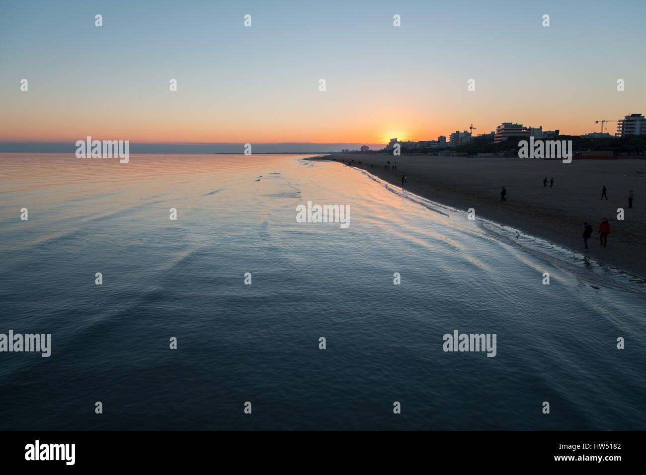 Sunset on the beach Stock Photo - Alamy