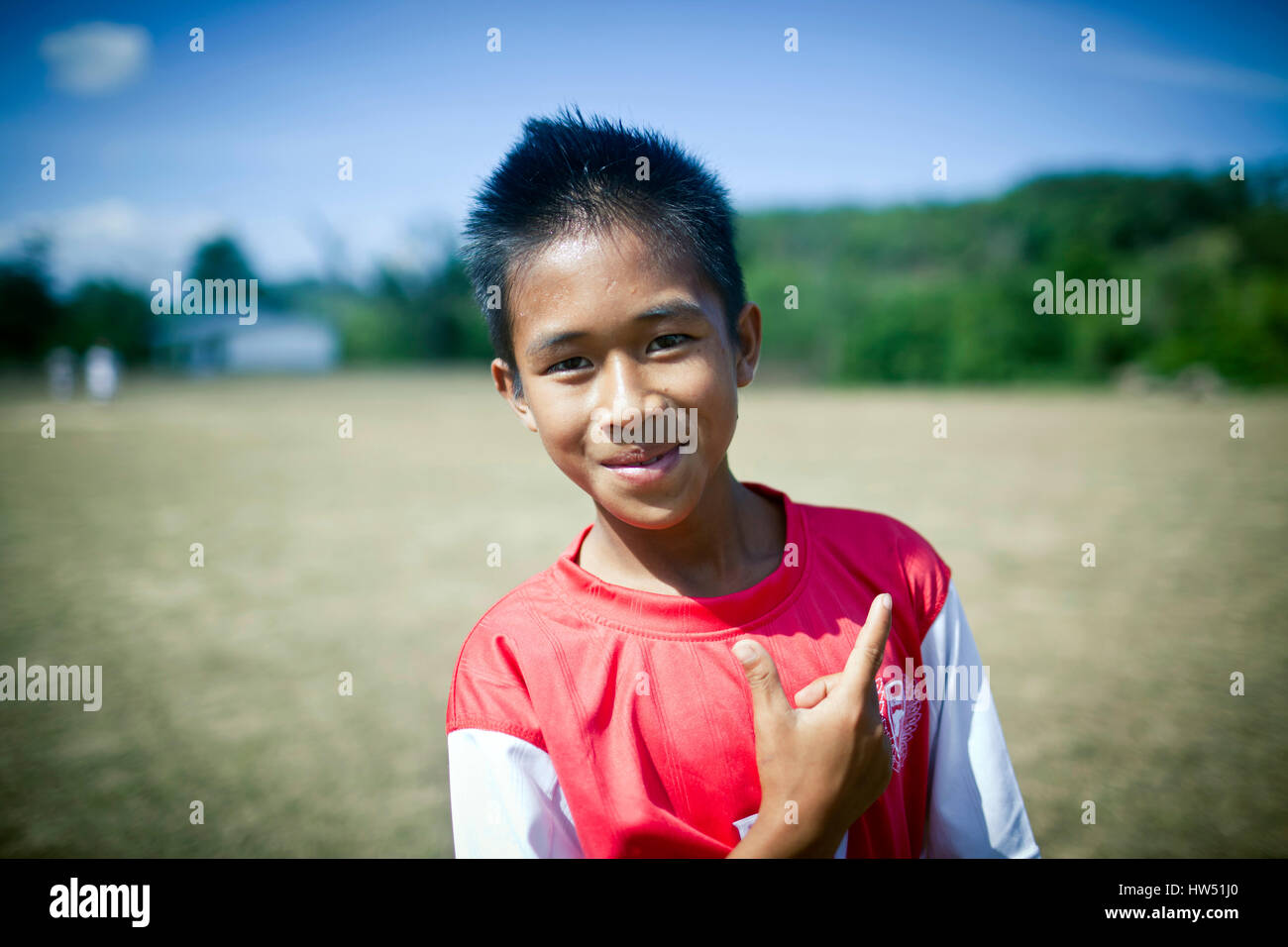 Smiling boy pictured in Laos Stock Photo - Alamy