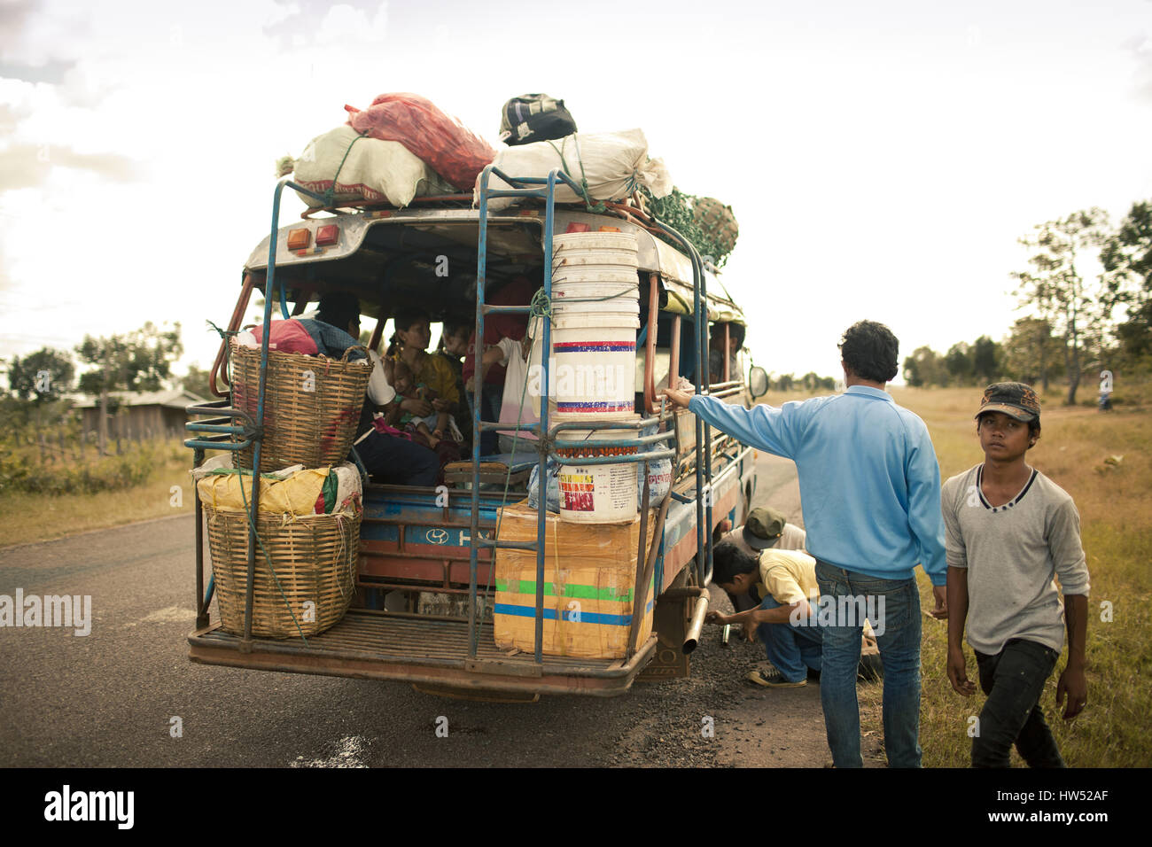Men are changing the wheel somewhere in Si Phan Don, Laos Stock Photo ...