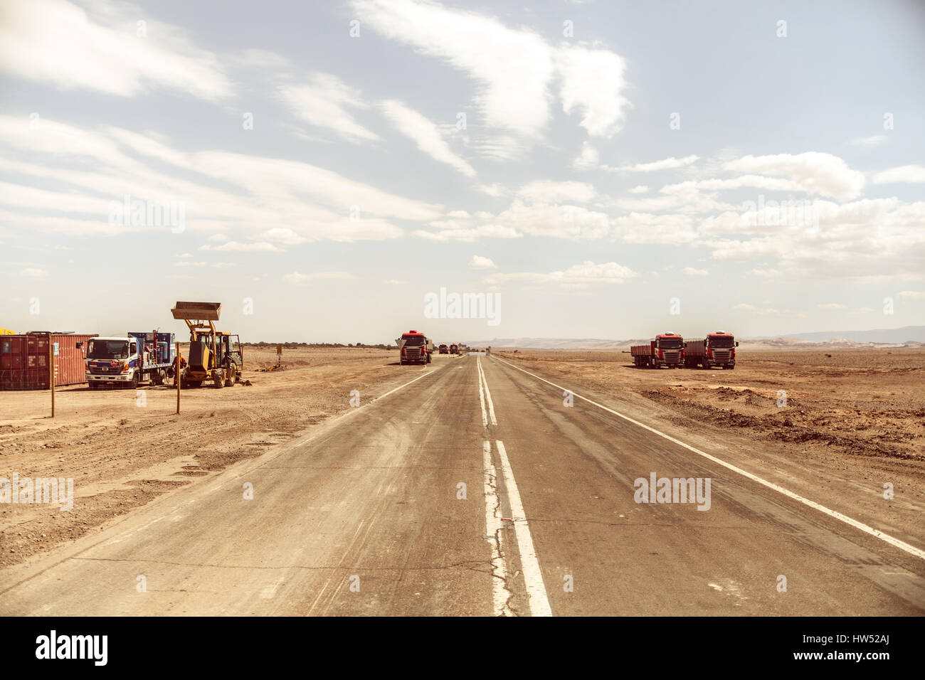 Trucks and containers in the Atacama Desert in Chile. It is a plateau ...