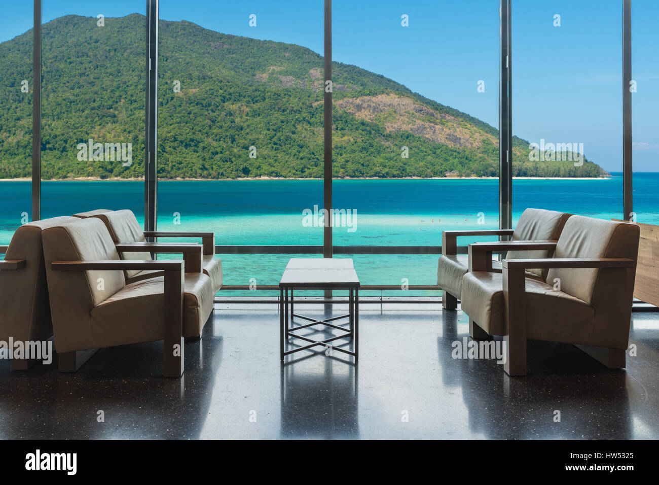 Luxury hotel lounge with windows overlooking sea in Phuket, Thailand ...