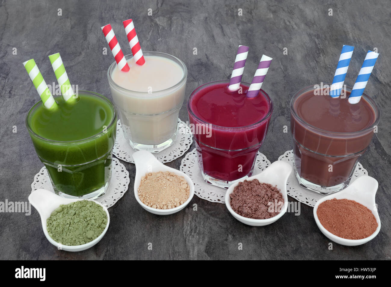 Health food drinks of wheat grass, maca root, acai berry and chocolate ...