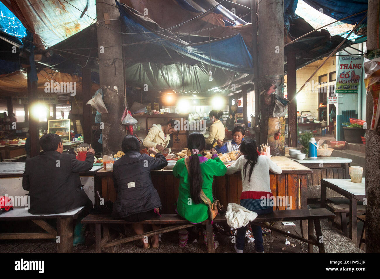 Sapa, Vietnam - May 06, 2014: Local people eating at the big table on ...