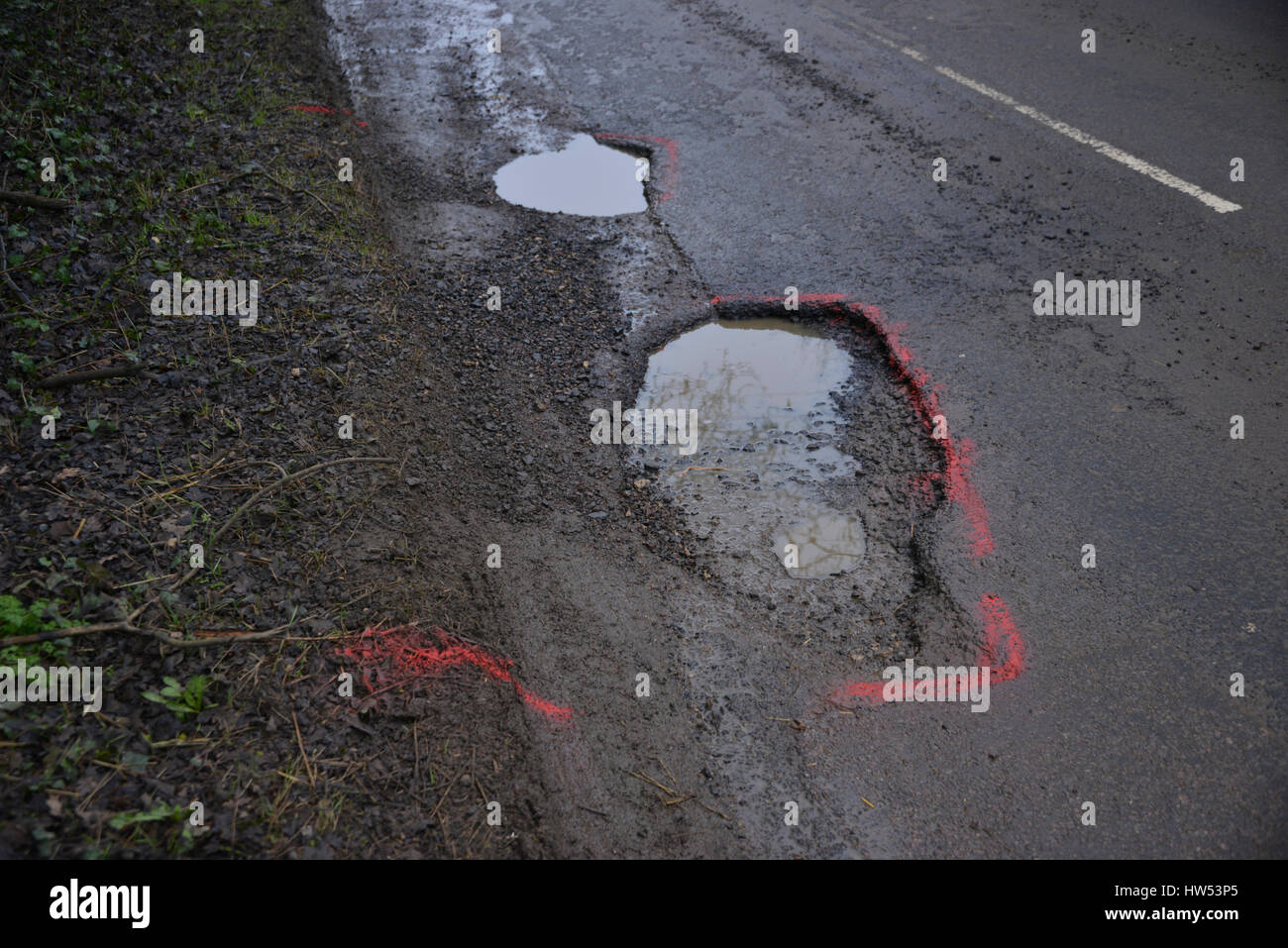 Roadside pothole on the edge of the road in the north Oxfordshire ...