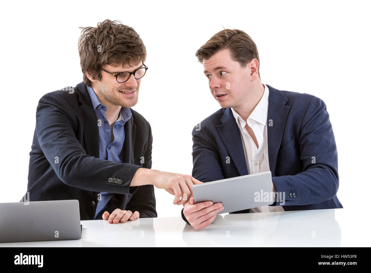 Two young business people starting up a company together Stock Photo ...