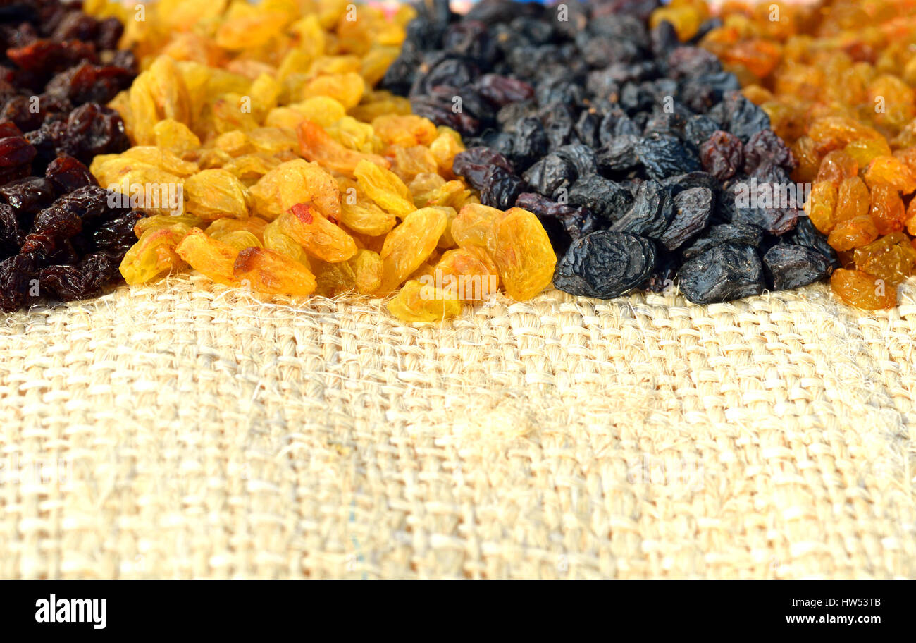 Various assorted raisins background Stock Photo - Alamy
