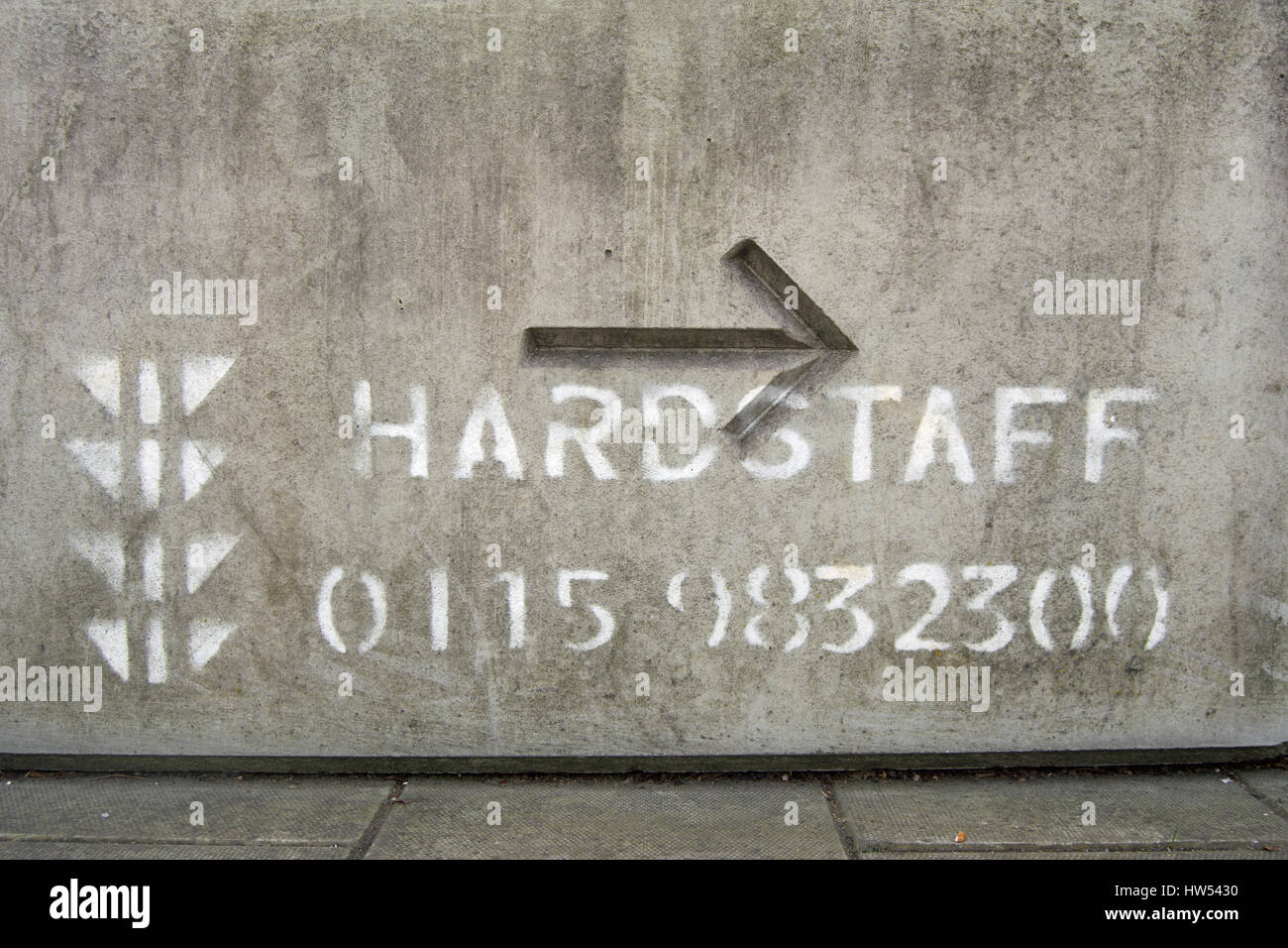 hardstaff concrete barrier with stencilled logo, name and telephone ...