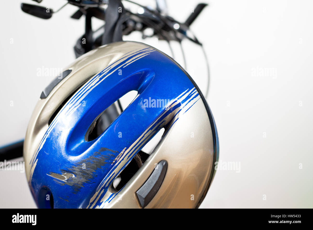 Old Scraped Safety Helmet On The Bike Stock Photo - Alamy
