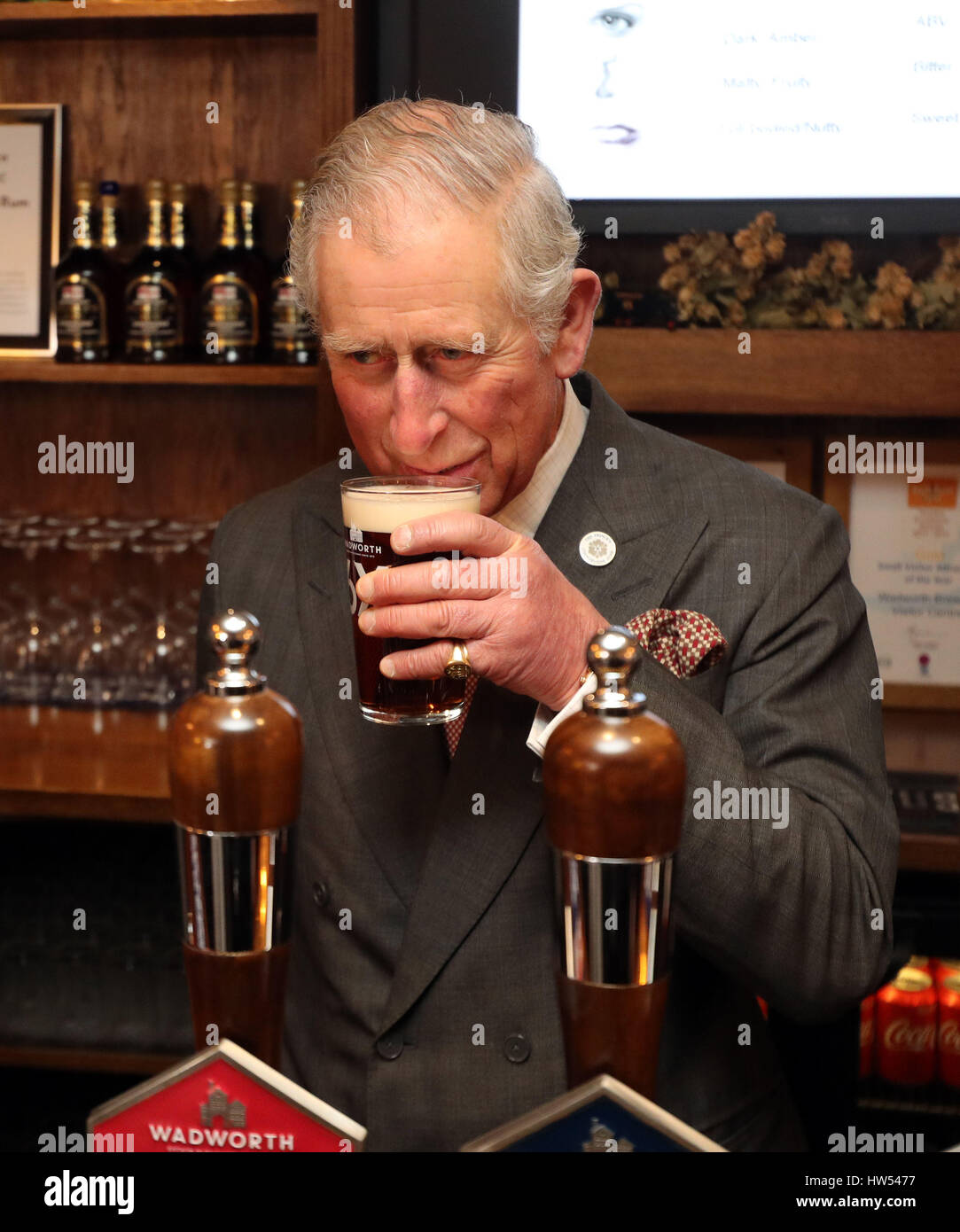 The Prince of Wales drinks from a pint of ale during a visit to the ...