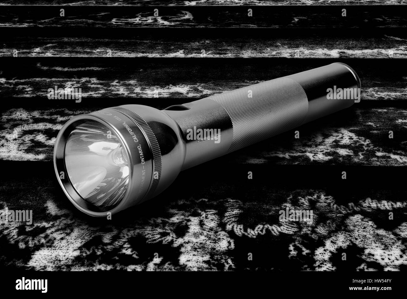 Hand held flashlight Black and White Stock Photos & Images - Alamy