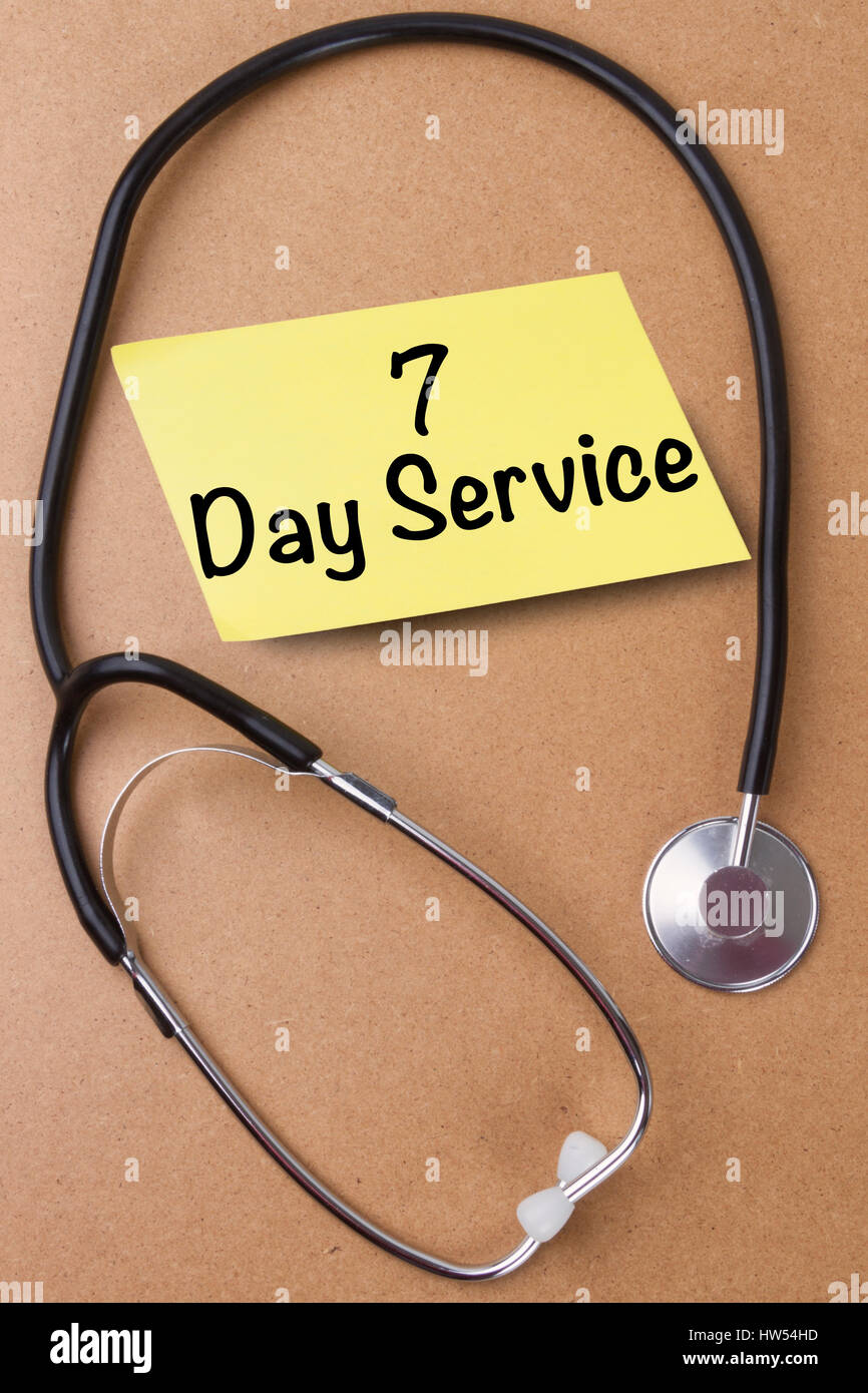 Medical stethoscope with post-it note saying "7 Day Service Stock Photo ...