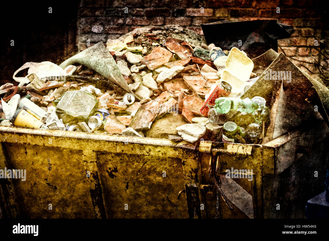 Waste skip full of domestic rubbish and rubble Stock Photo - Alamy