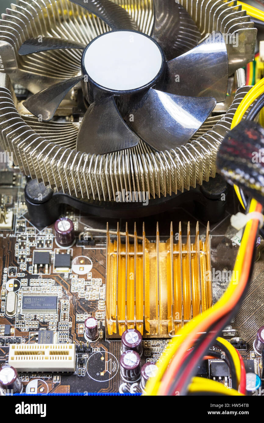 The photo shows a motherboard with a cooler Stock Photo - Alamy
