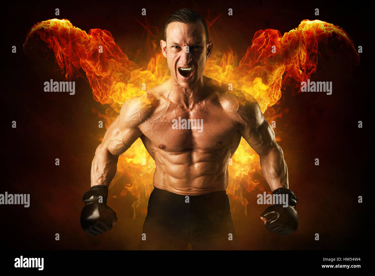 Strong Mixed Martial Arts fighter with fire wings Stock Photo - Alamy