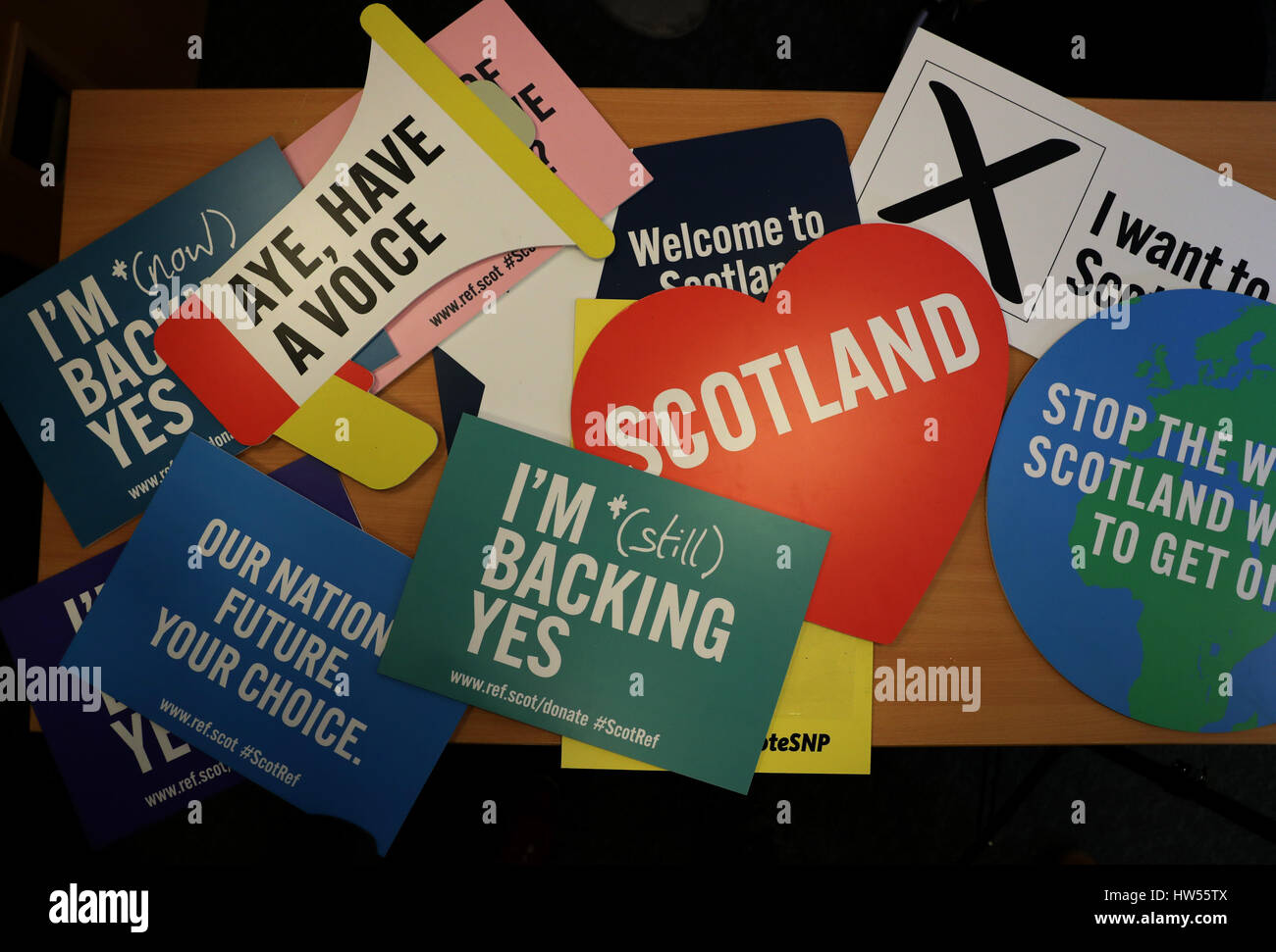 Placards sit on a table at the SNP Spring Conference at the AECC in ...