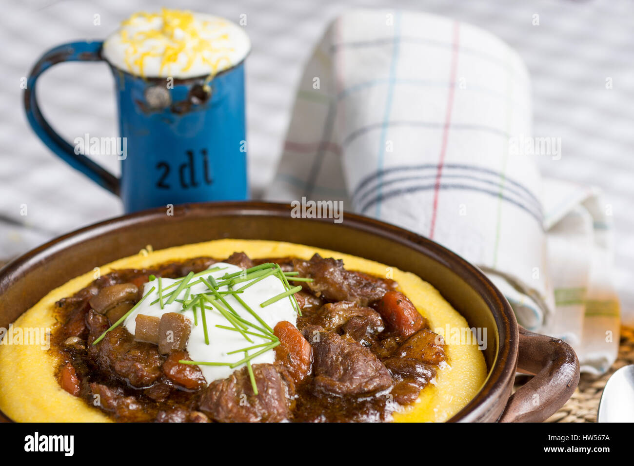 Beef Stew with Mushrooms, Carrots and Corn Polenta Stock Photo - Alamy