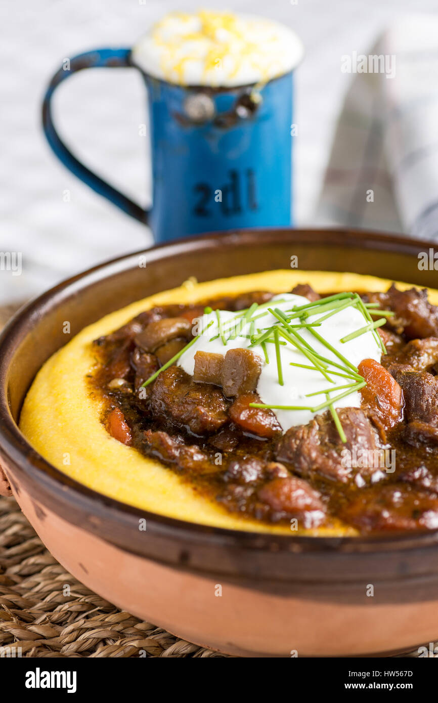 Beef Stew with Mushrooms, Carrots and Corn Polenta Stock Photo - Alamy