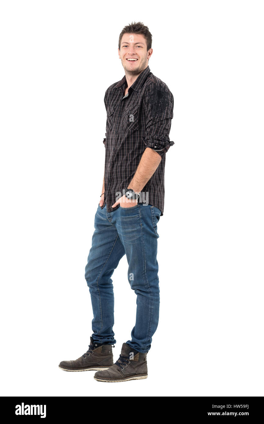 Relaxed happy laughing young man wearing jeans and plaid shirt. Full ...