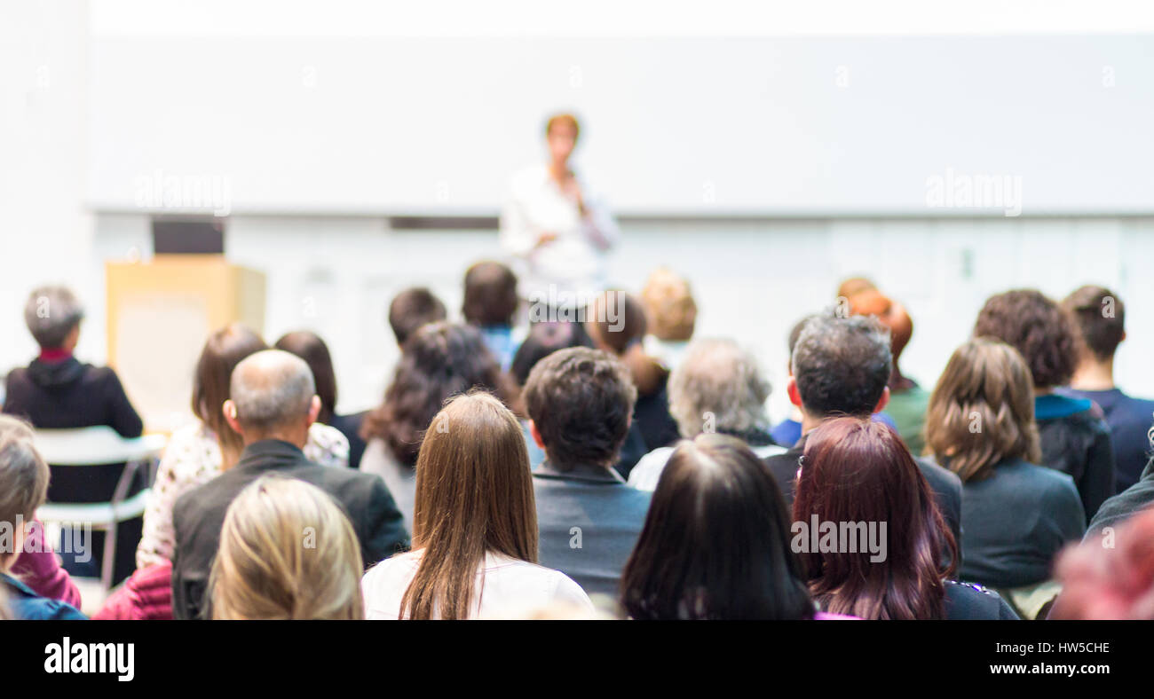Woman giving presentation on business conference Stock Photo - Alamy