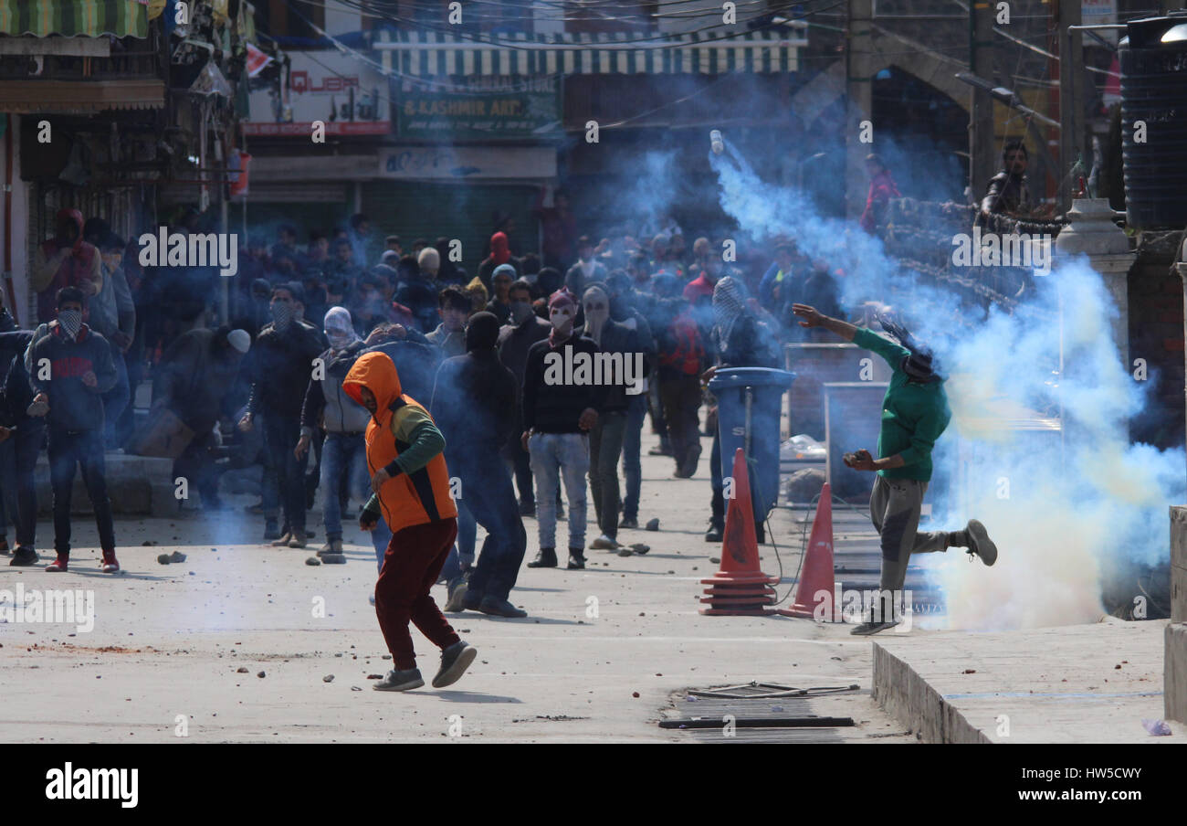 Srinagar, Kashmir. 17th Mar, 2017. Youth throwing a tear smoke shell ...