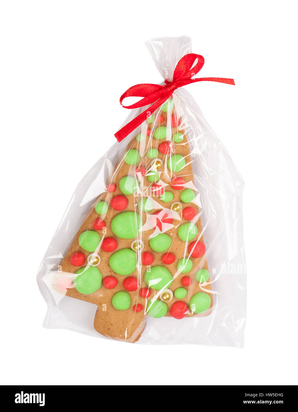 Christmas gingerbread tree cookie in transparent packing with a bow ...