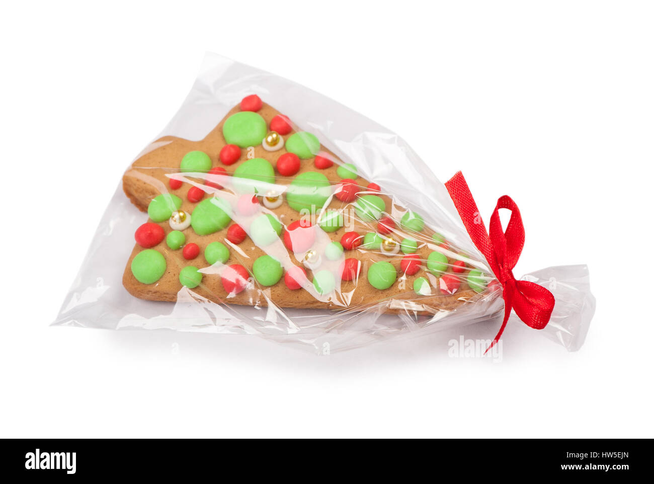 Christmas gingerbread tree cookie in transparent packing with a bow ...