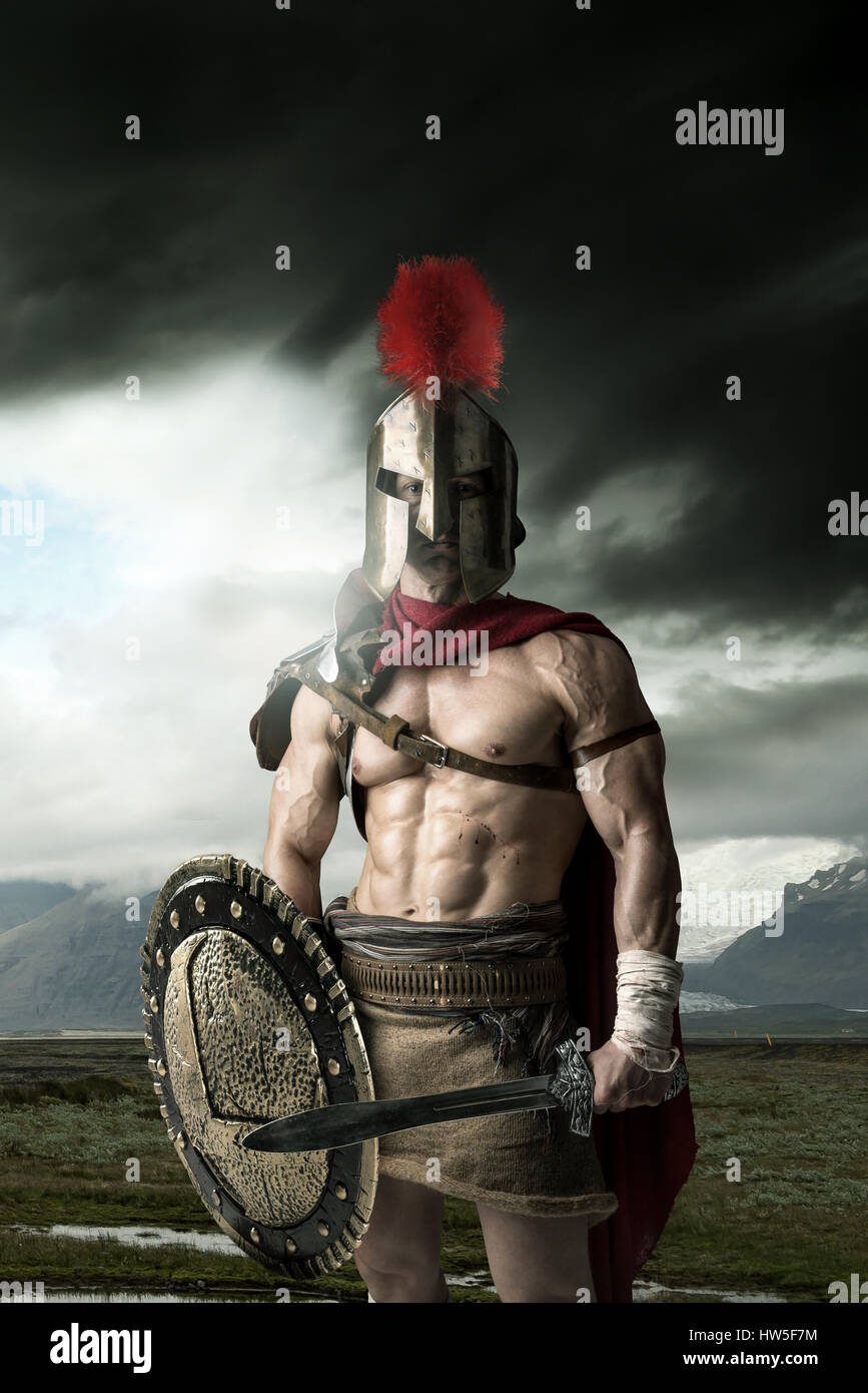 Ancient warrior or Gladiator posing outdoors with helmet Stock Photo ...
