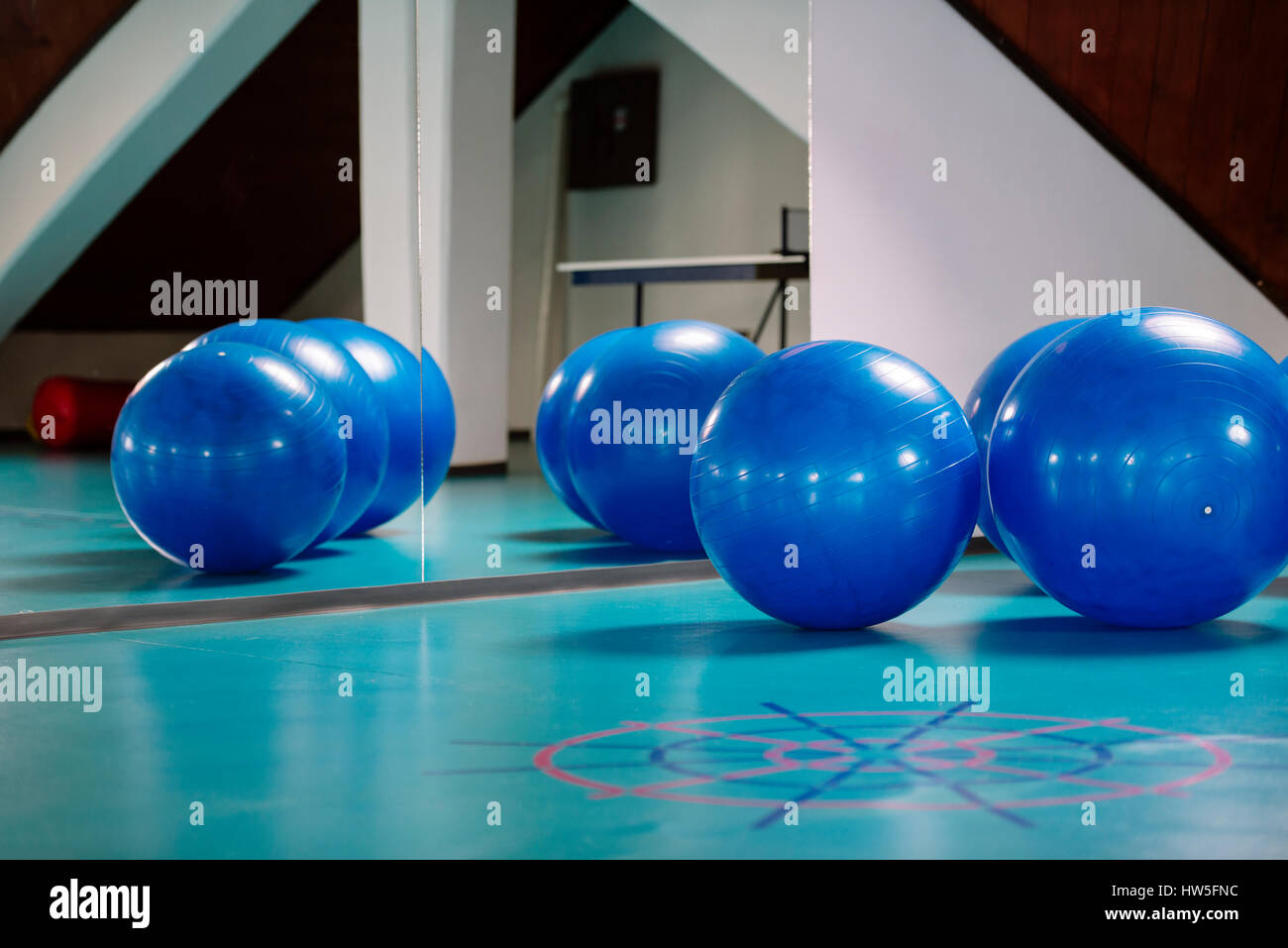 Group of blue pilates balls in the gym Stock Photo - Alamy