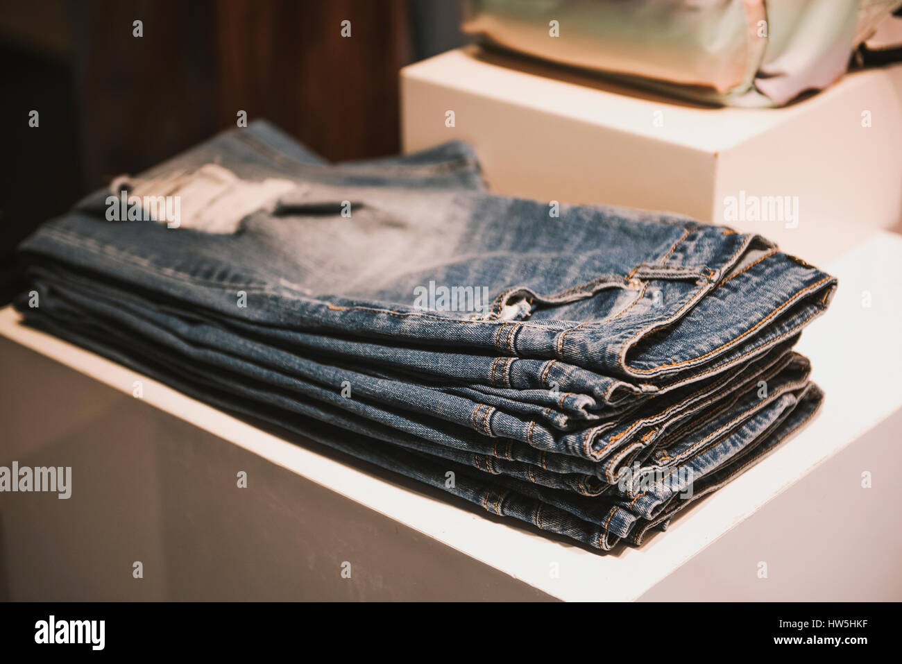 Jeans in a retail store Stock Photo - Alamy