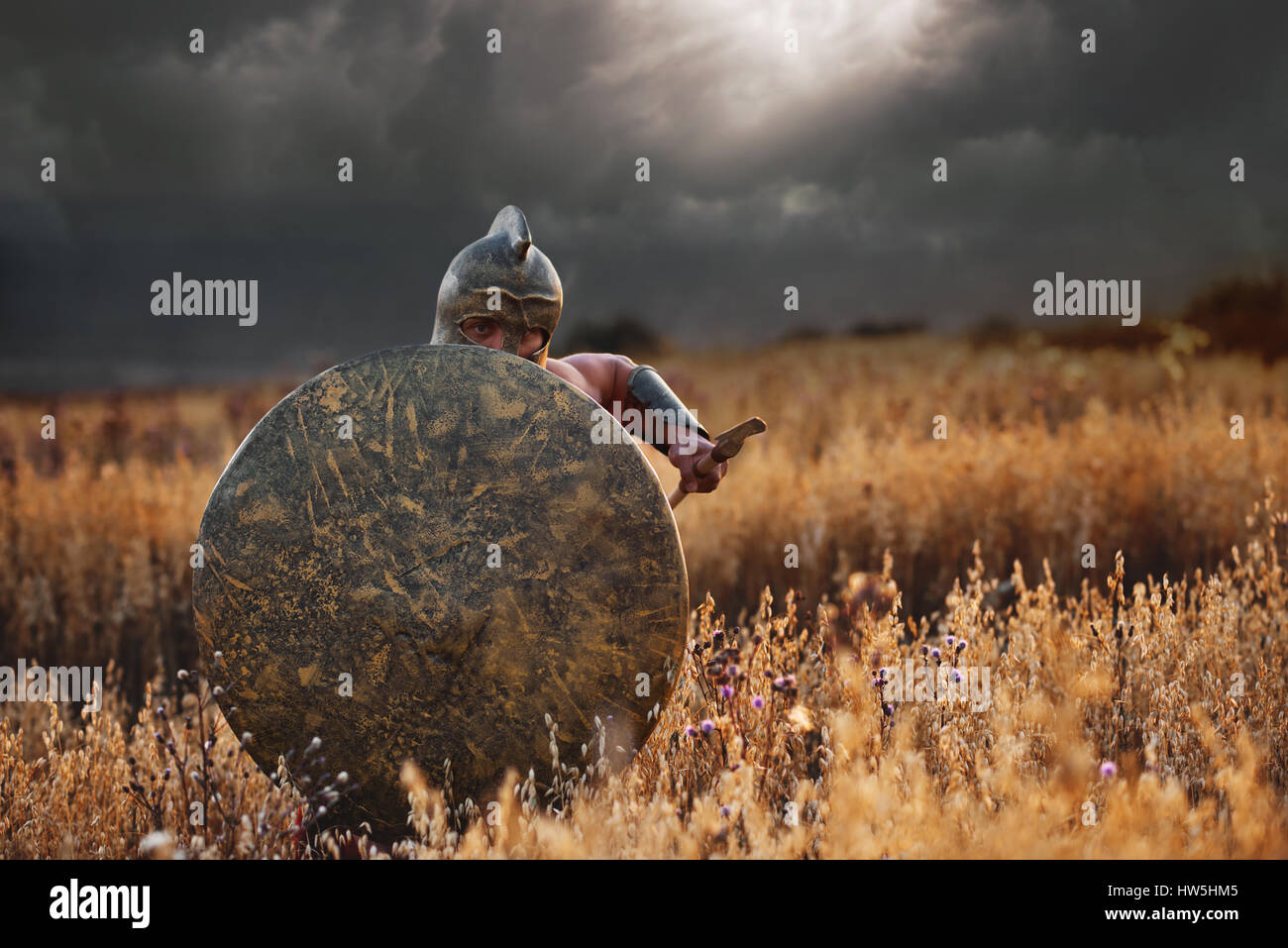 Warrior like spartan going forward in attack Stock Photo - Alamy