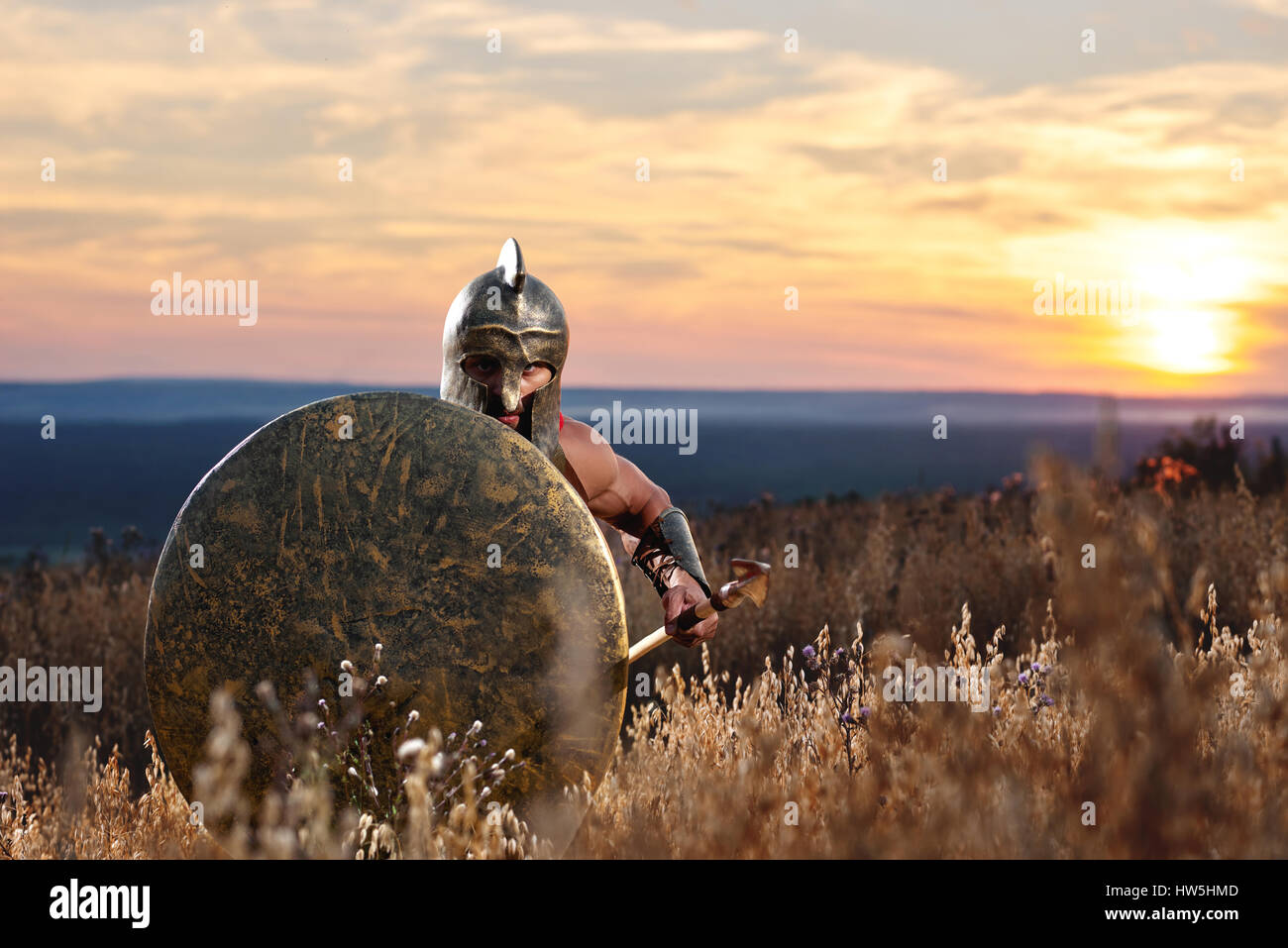Warrior like spartan going forward in attack Stock Photo - Alamy