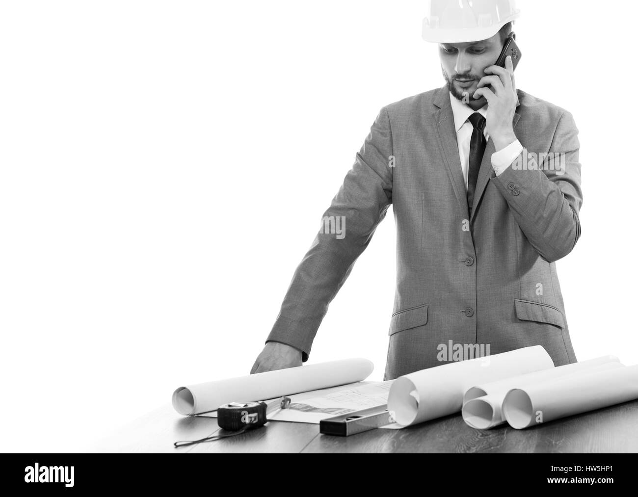 Professional male architect using his smart phone Stock Photo - Alamy