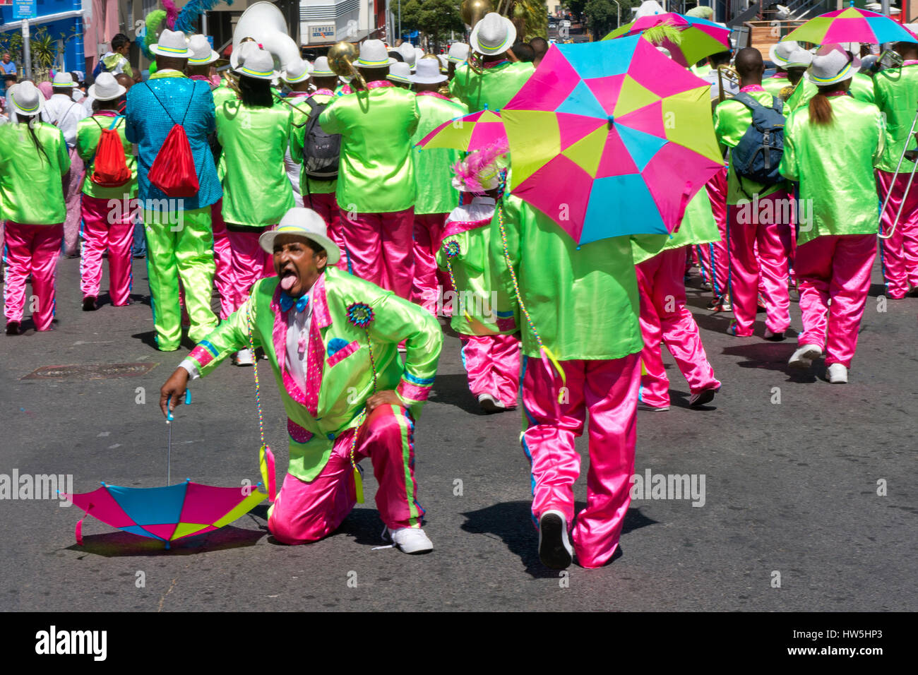 Street parade festival with music band of minstrels and dancers in ...