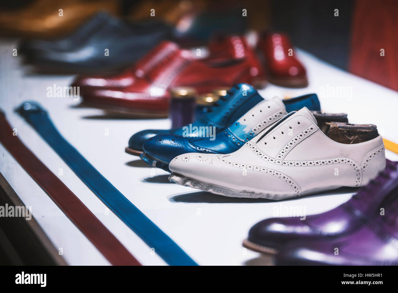 Fancy colorful shoes in a men clothing store Stock Photo - Alamy