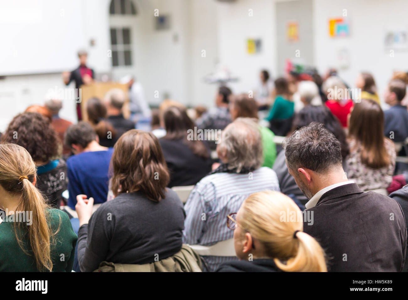 Woman giving presentation on business conference Stock Photo - Alamy