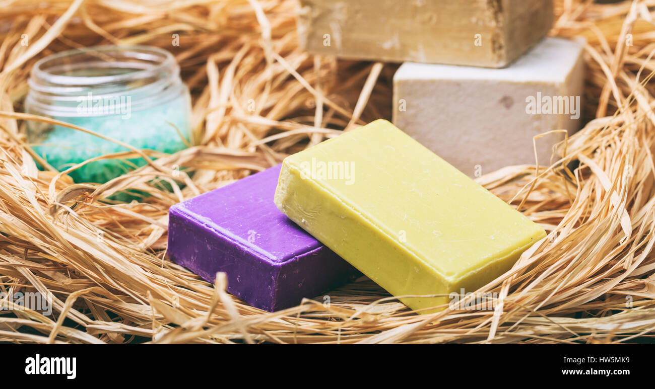 Natural handmade soap bars on straw background Stock Photo - Alamy