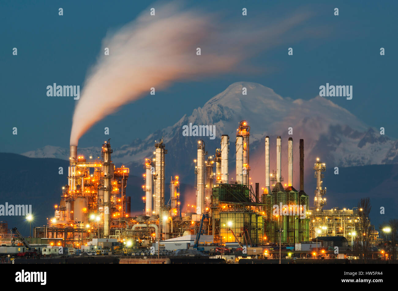 Tesoro Oil Refinery at dusk, Mt. Baker behind, from Fidalgo Bay Stock ...