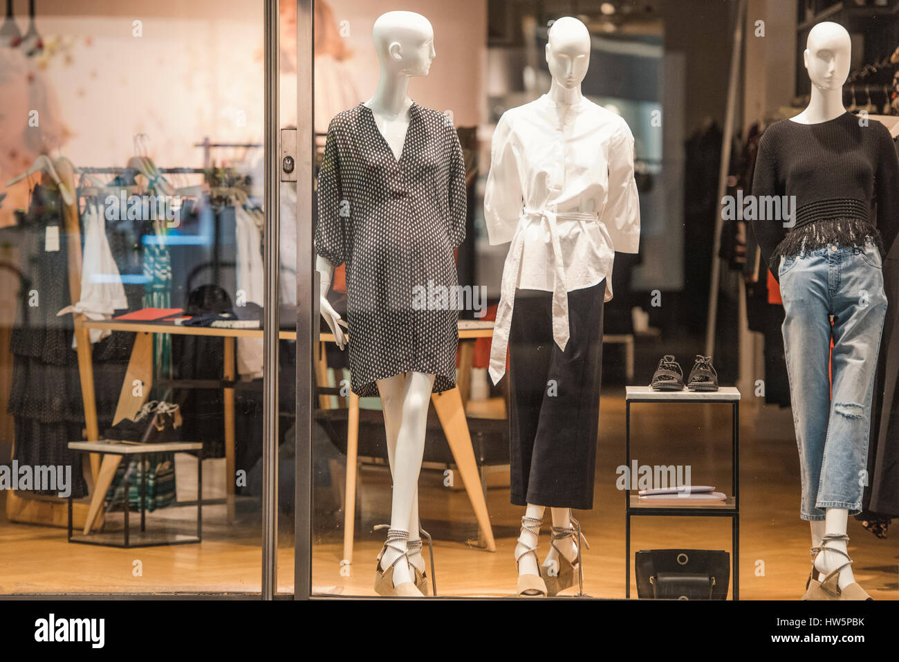 Mannequins in a storefront of an elegant store Stock Photo - Alamy