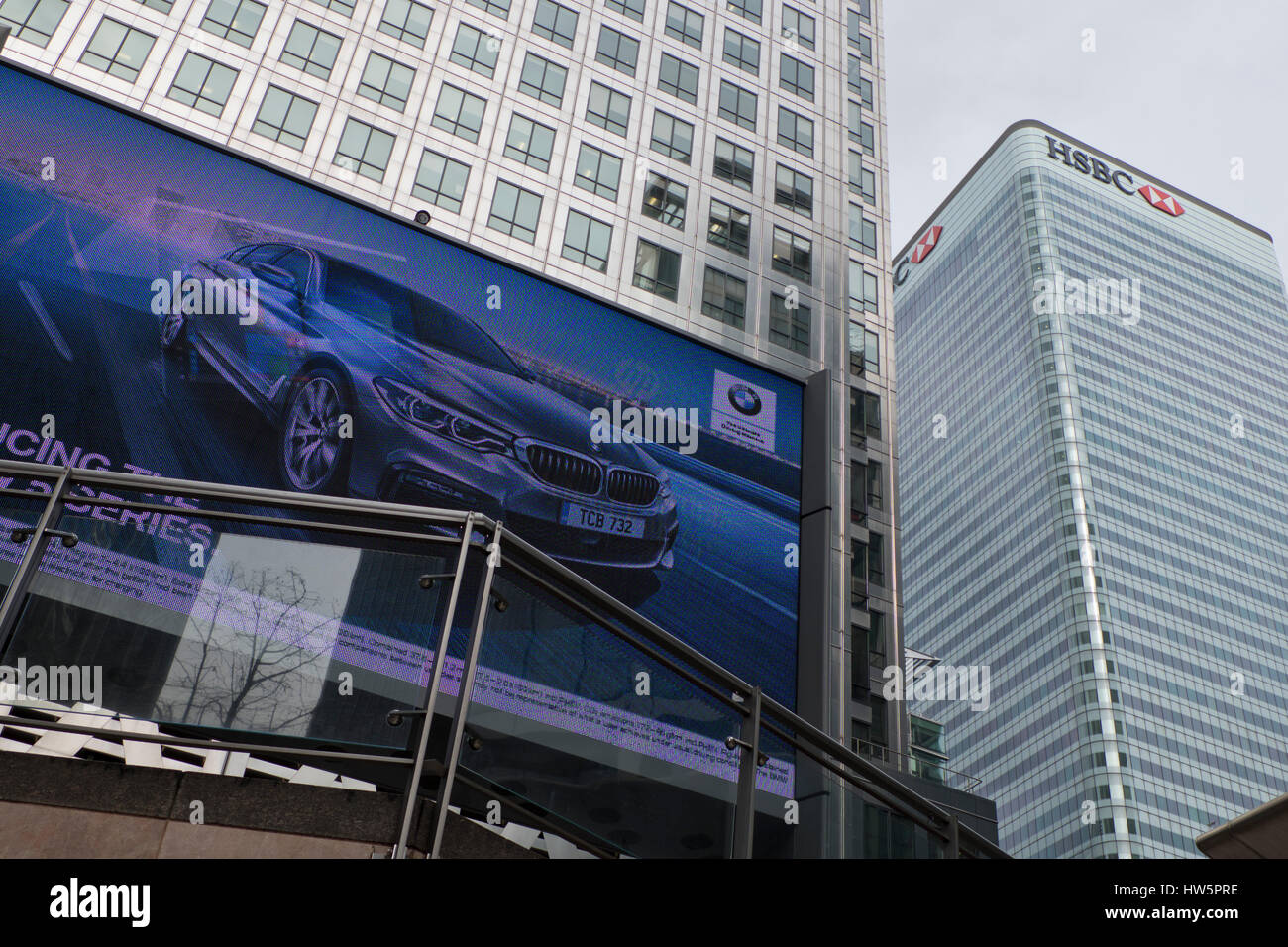 Luxury car advertising shown at screen in Canary Wharf,with HSBC bank ...