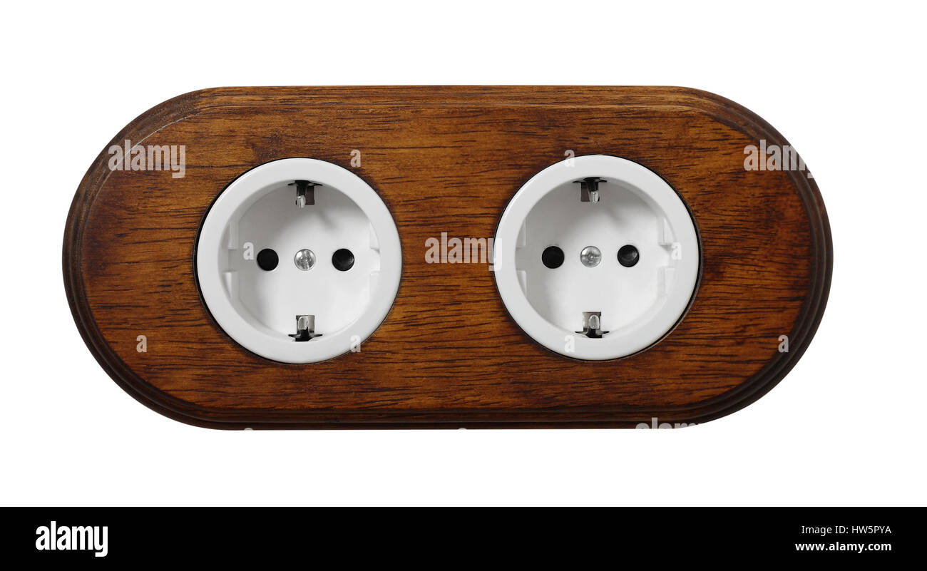 The double wooden electric socket with grounding on a white background ...