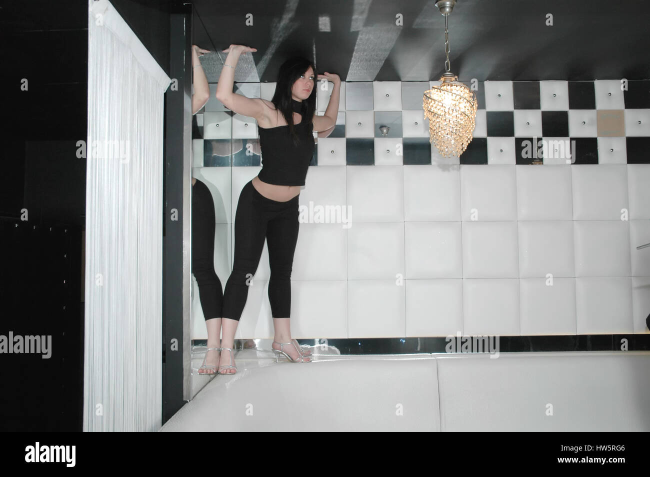 Brunette dancer in a club setting Stock Photo - Alamy